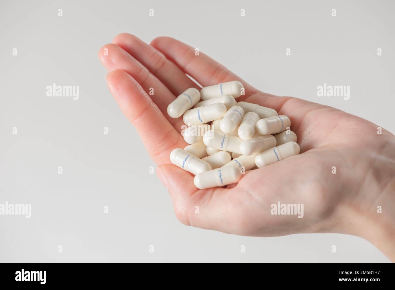 Antibiotics. The concept of antibiotic therapy, drug treatment. A woman ...