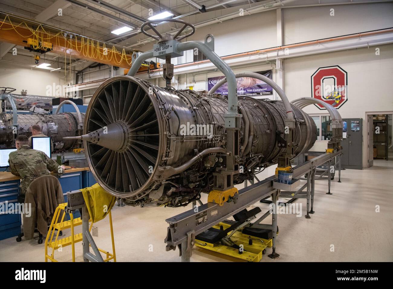 An F-16 Fighting Falcon engine sits on a maintenance stand during an ...