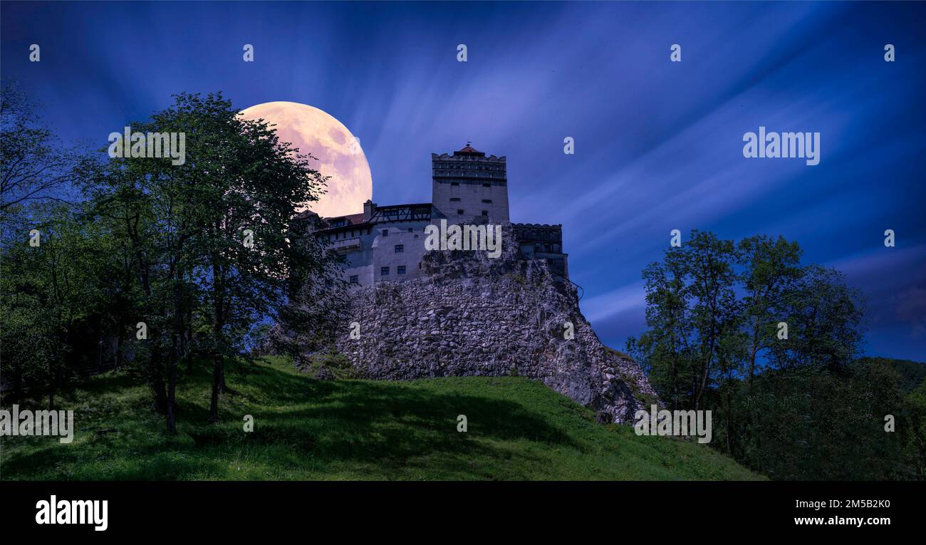 The moon behind the castle Bran Castle. Bran, Brasov, Transylvania ...