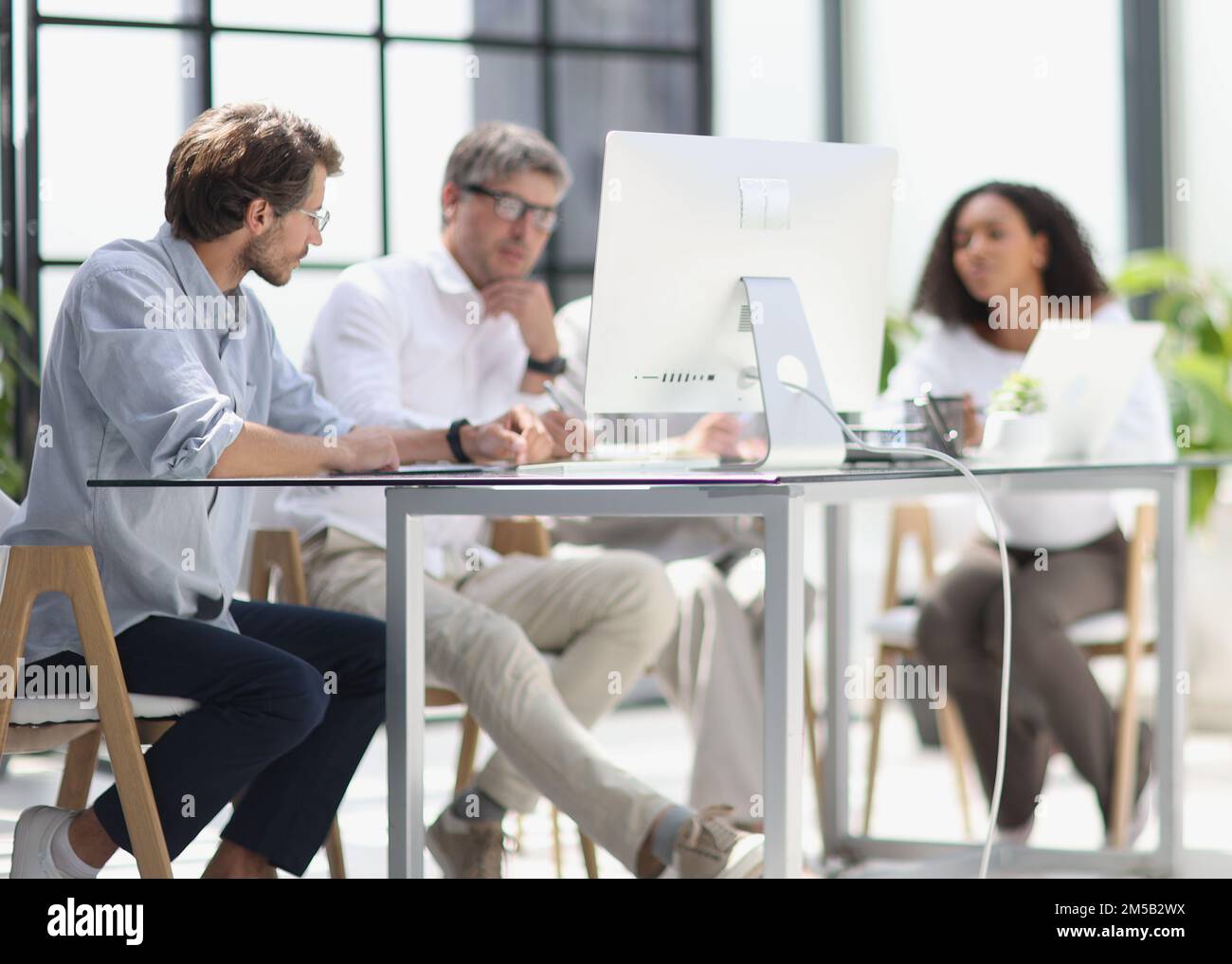 Conversation between managers and employees in the office Stock Photo ...