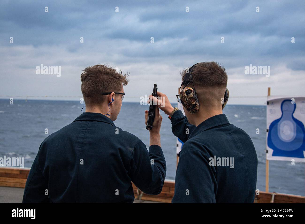PHILIPPINE SEA (Feb. 17, 2022) Yeoman 2nd Class Clinton Pell, left ...