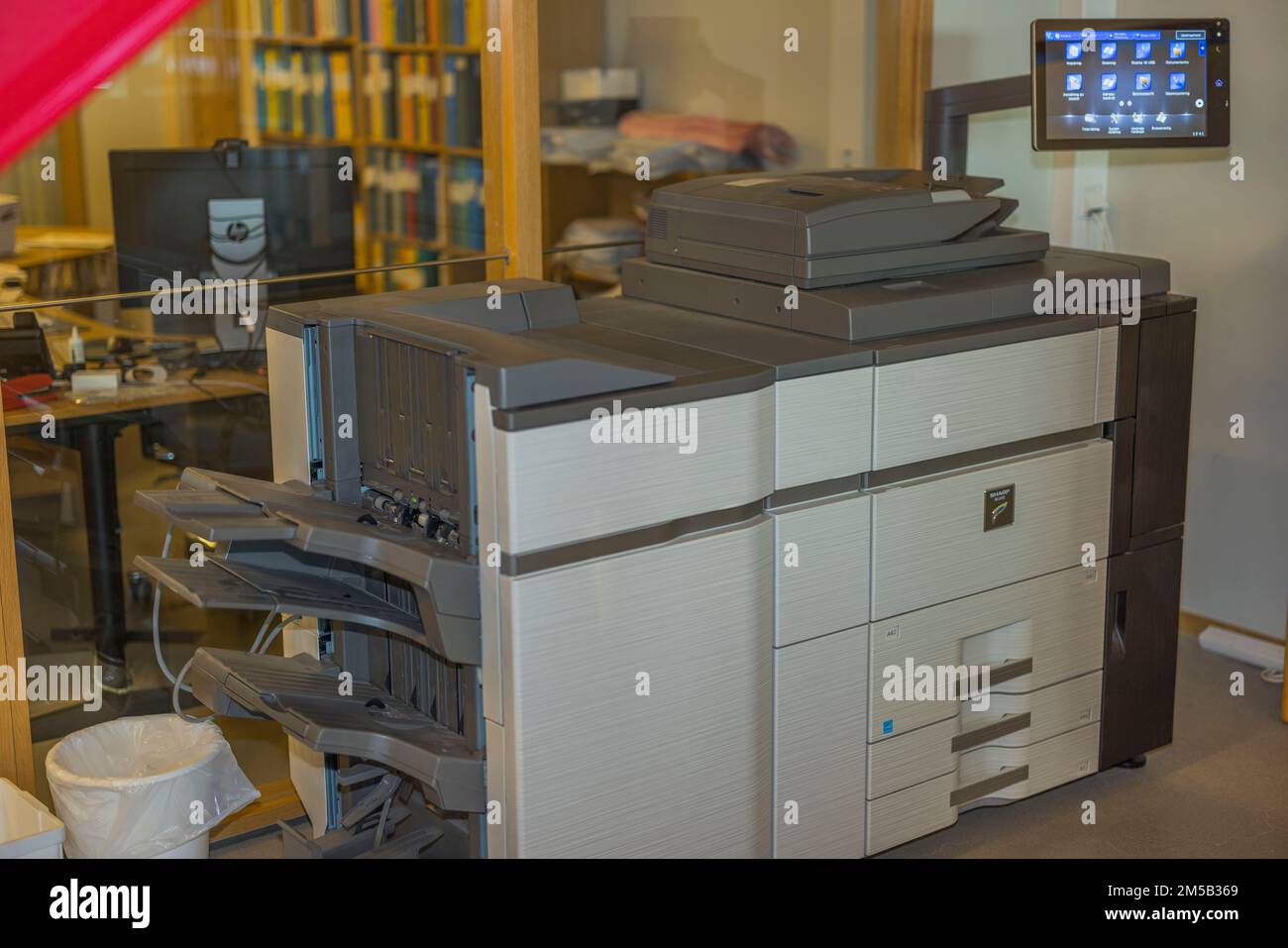 Close-up view of SHARP color laser multifunction printer in office area ...