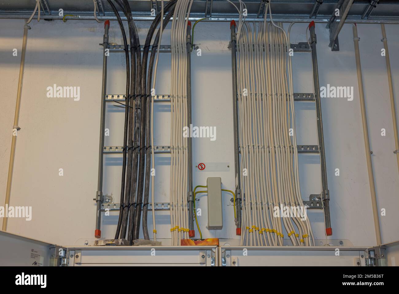 Close-up interior view of organized cable store mounted on wall. Sweden ...