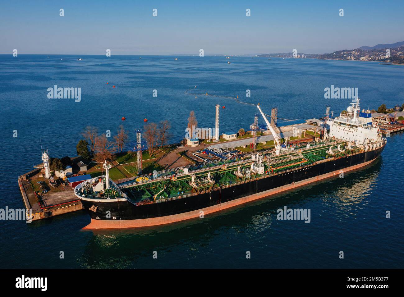 Ship tanker with LPG, oil or chemical production. Process of loading of ...