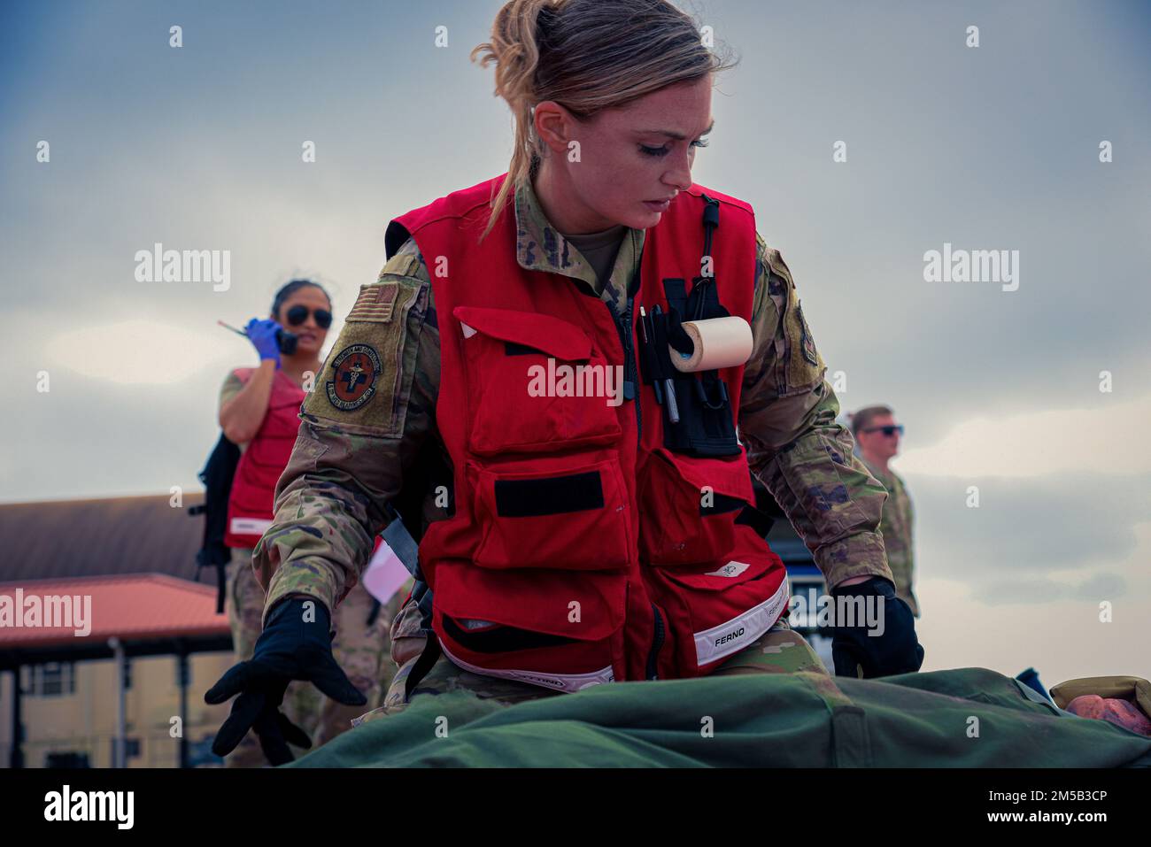 A U.S. Airman from the 6th Medical Group, renders aid to a simulated ...