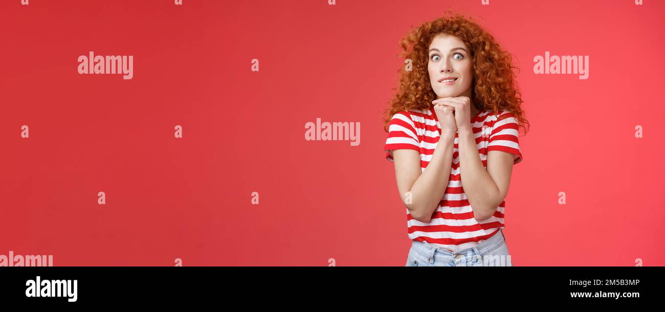 Excited thrilled young impulsive good-looking redhead female stare ...