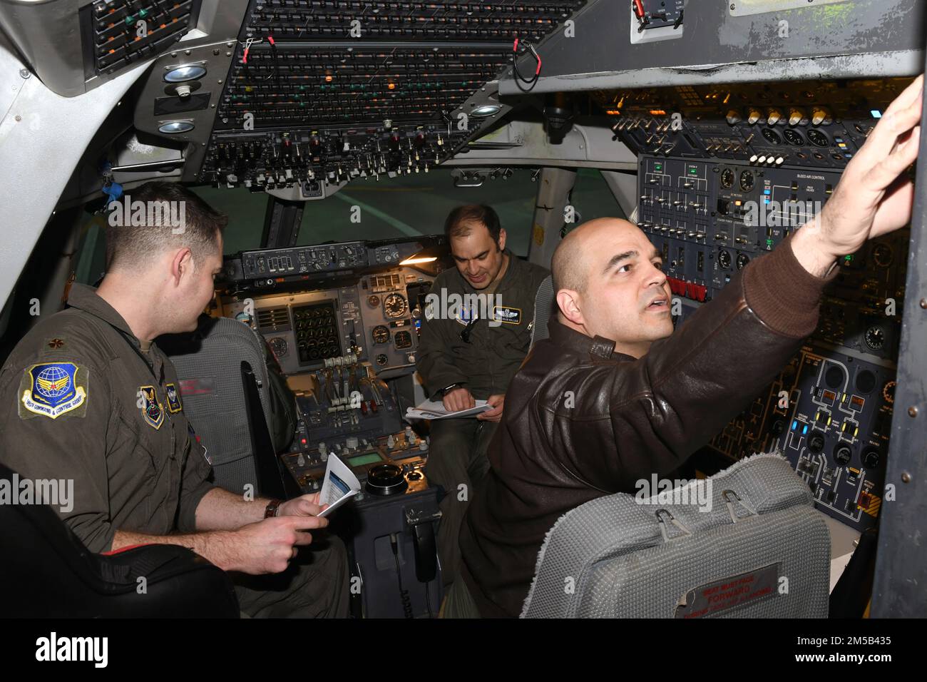 Maj. Garrett Kohl, an E-4B pilot, left, Master Sgt. Sean Killian ...