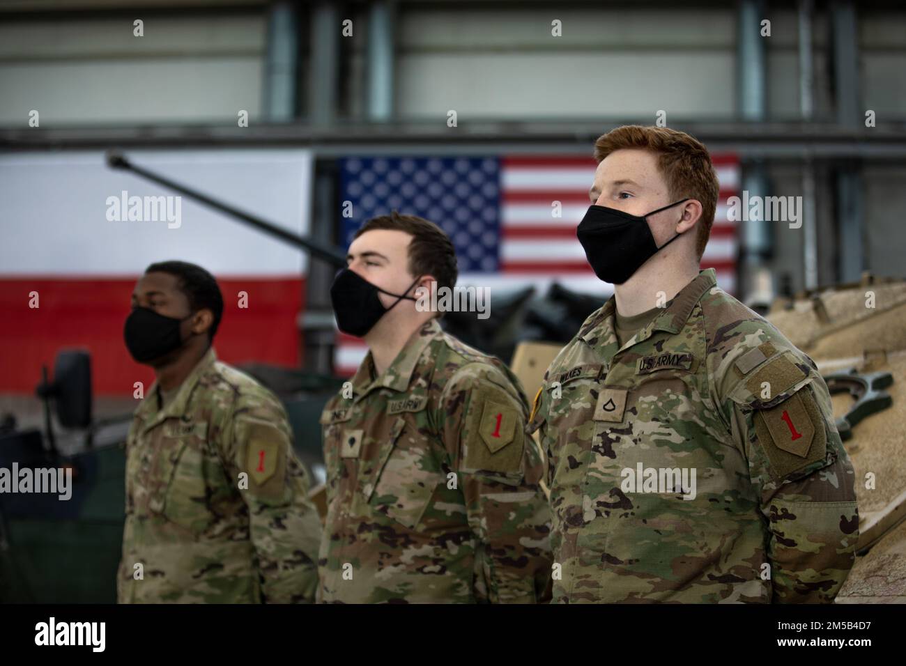 U.S. Army Soldiers stand at parade rest in front of the military ...