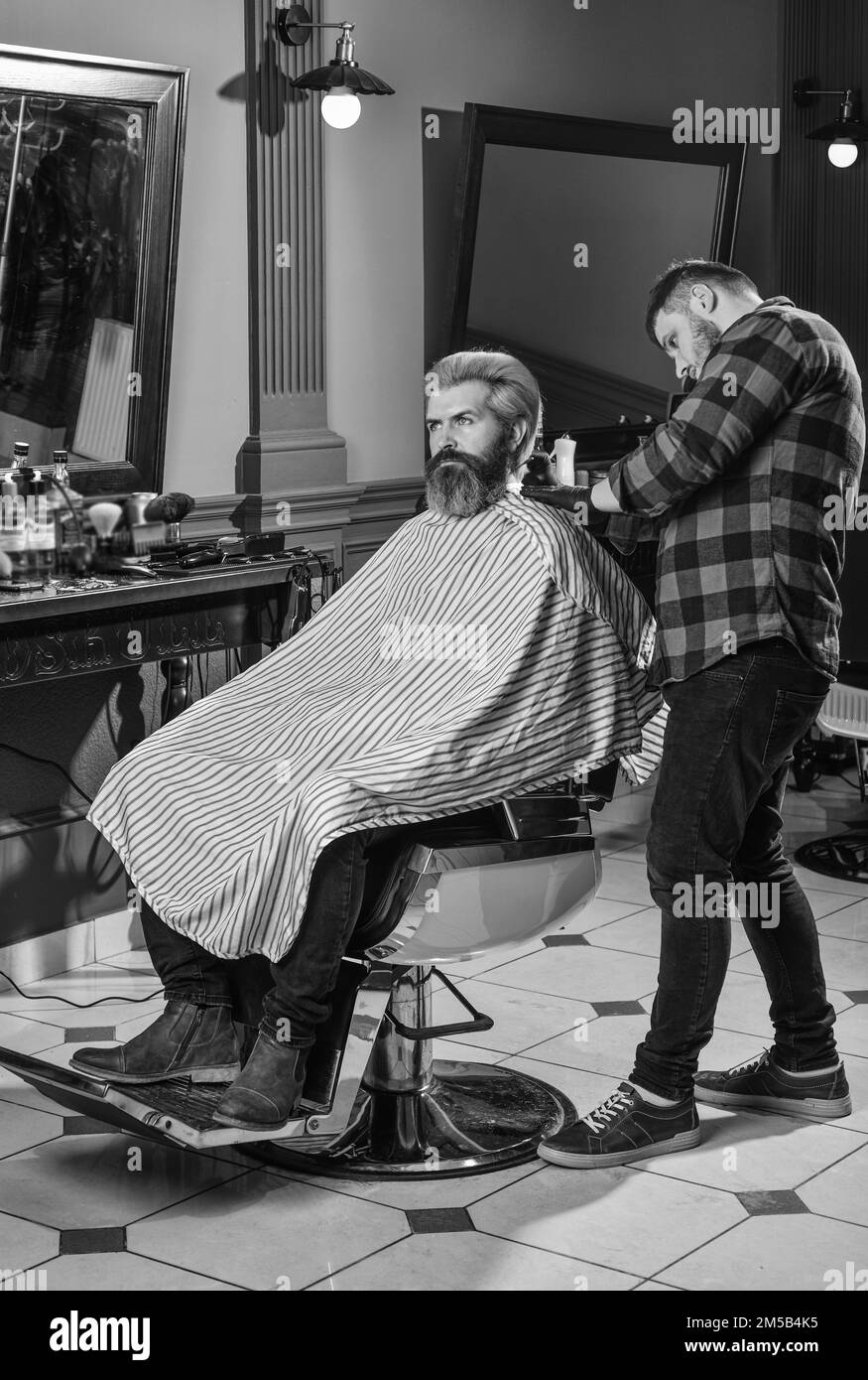 Professional barber and client. Hipster man want new hairstyle ...