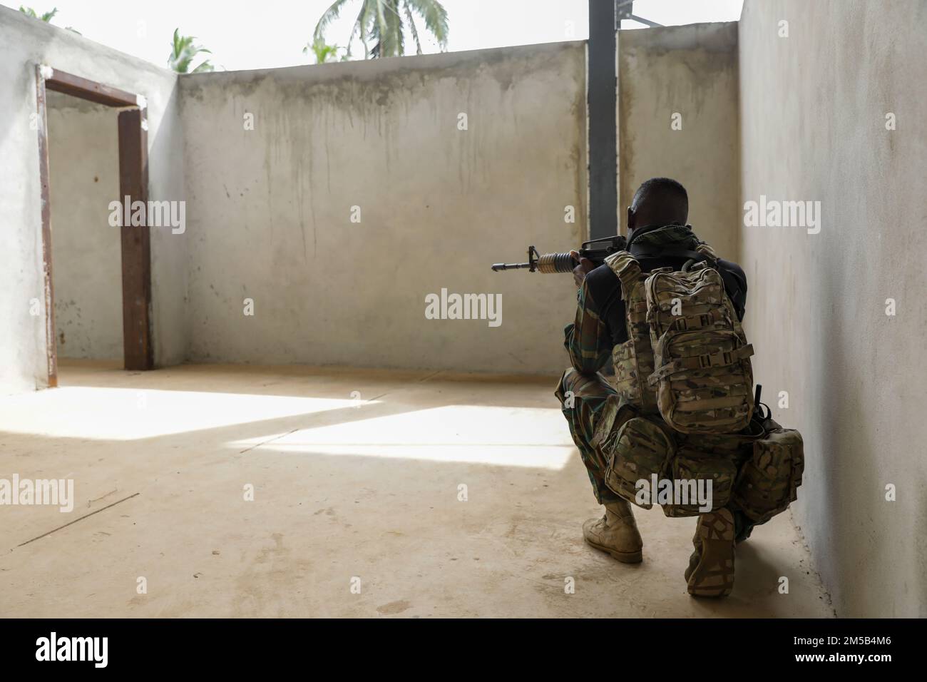 A Ghana Special Forces Soldiers provide security during close quarter ...