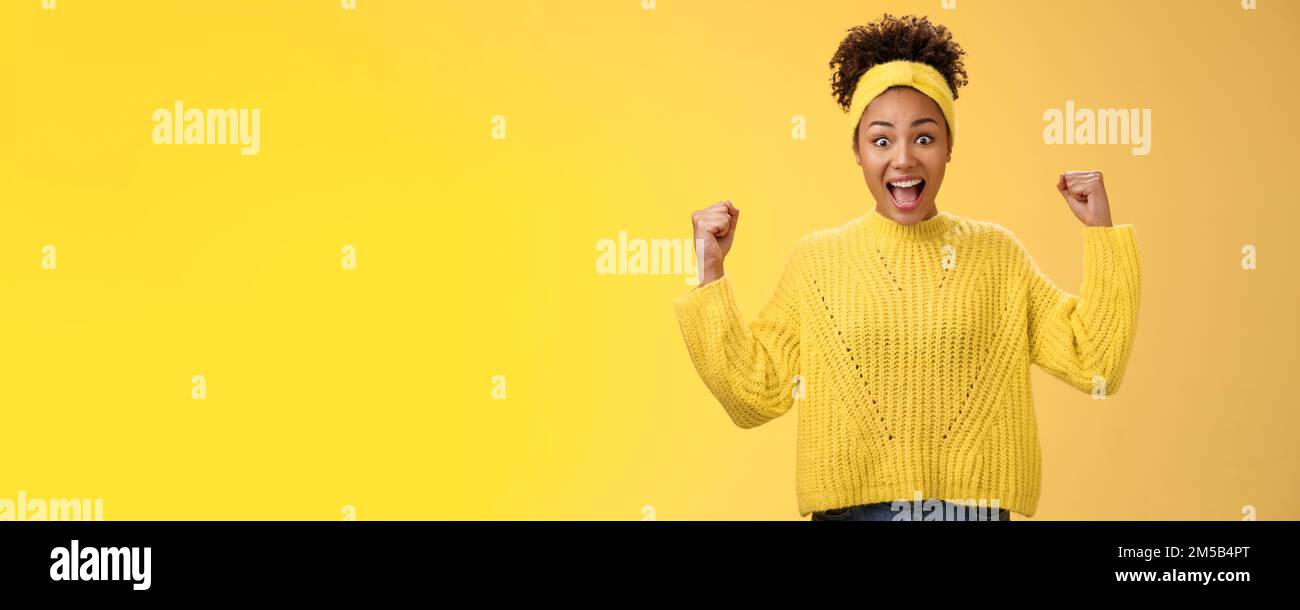 Yes finally prize mine. Excited surprised amused african-american girl ...