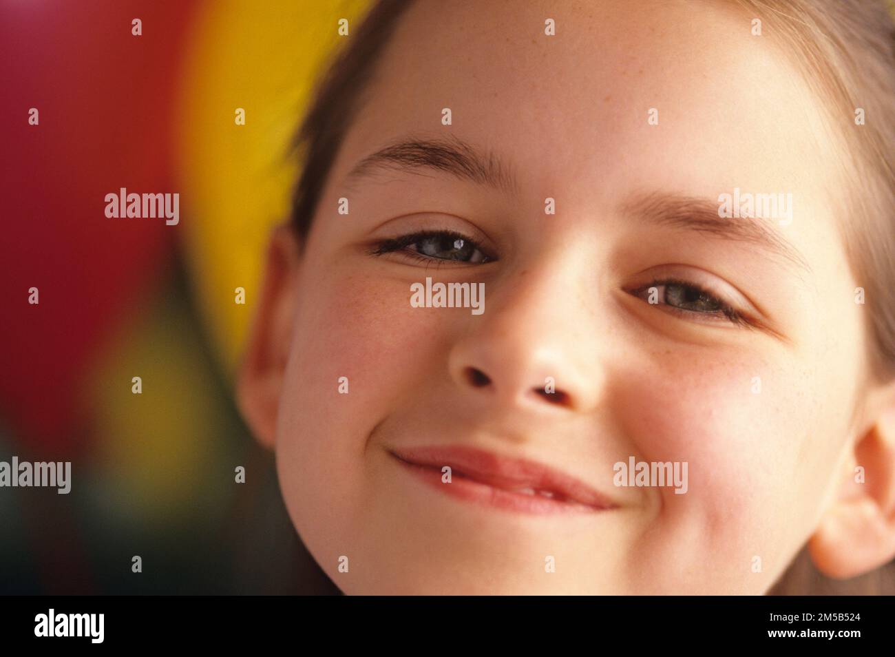 Young girl smiling into camera Stock Photo - Alamy
