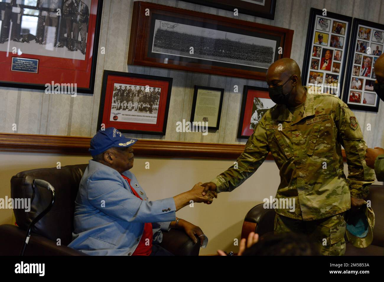Dr. Eugene Richardson, an original Tuskegee Airman, shakes hands with U ...