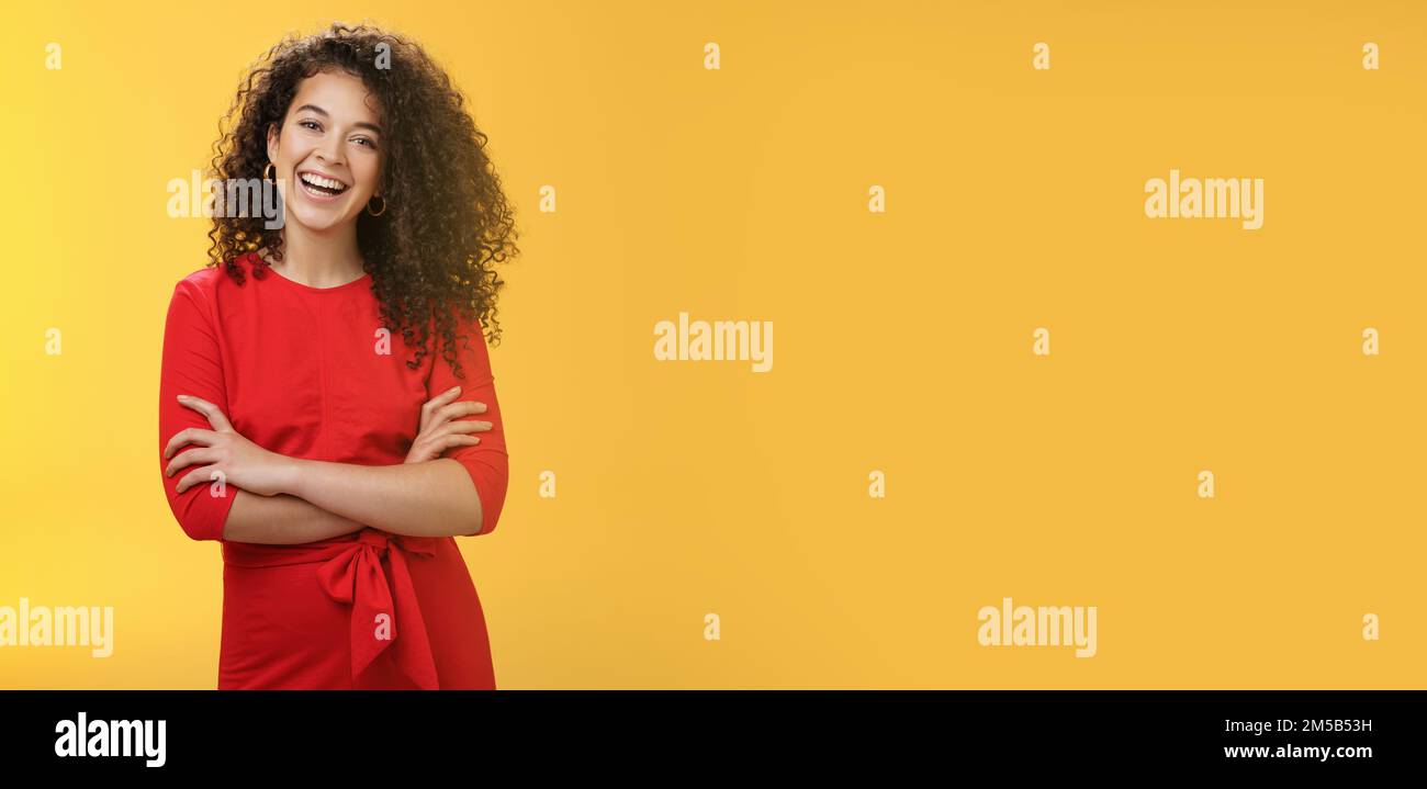 Self-assured happy enthusiastic curly-haired female reporter in cute ...