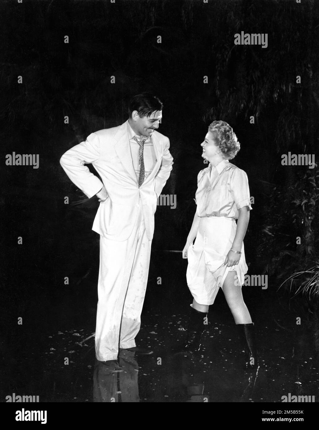 CLARK GABLE and LANA TURNER on set candid on jungle set during filming ...
