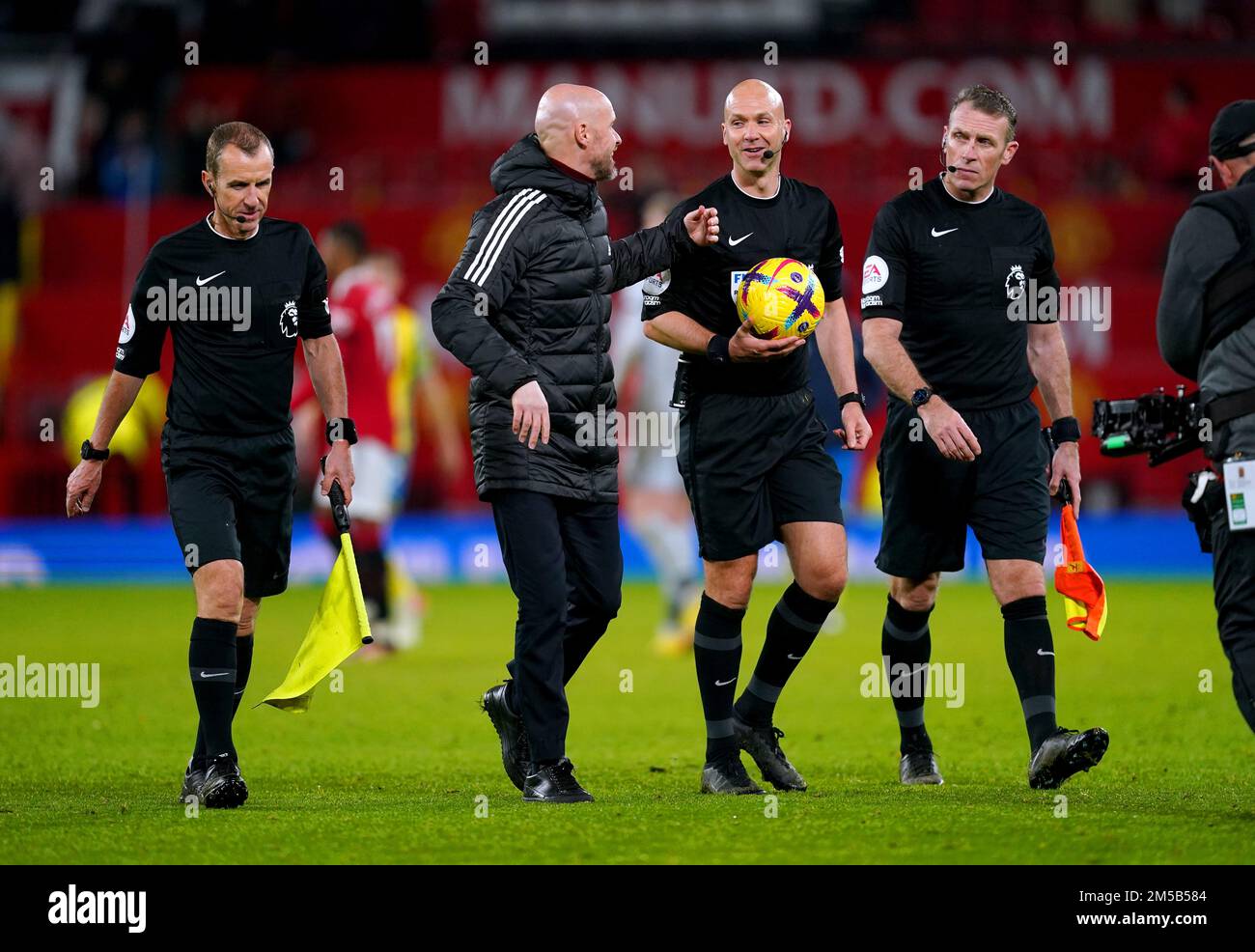 Manchester United manager Erik ten Hag speaks to referee Anthony Taylor ...