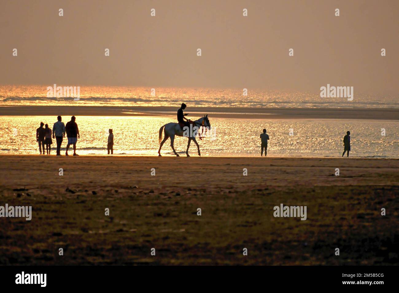 Mandarmani, West Bengal, India. 27th Dec, 2022. Tourists walk along the ...