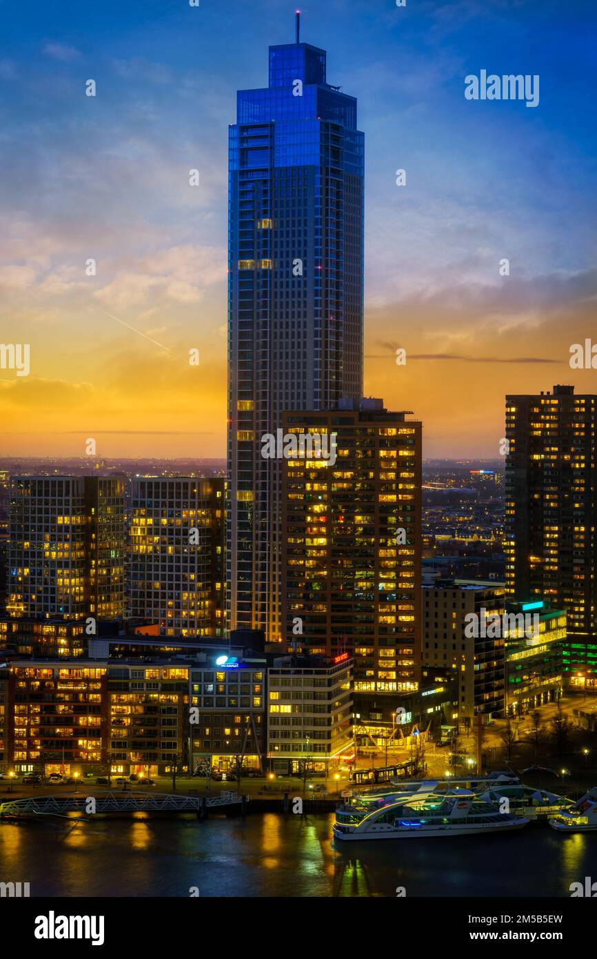 A scenic view of highrise buildings and city skyline with lights during ...