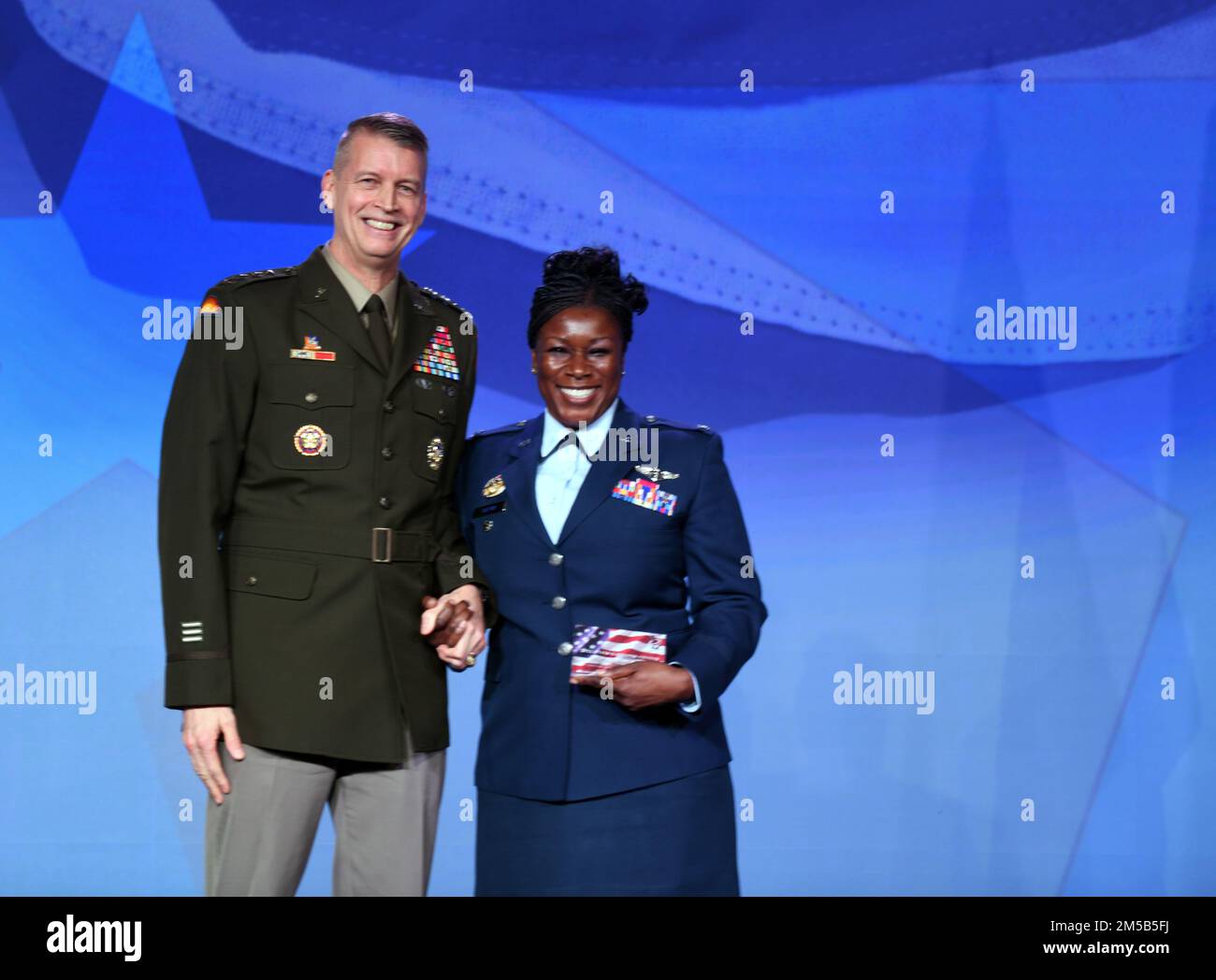 Army Gen. Daniel Hokanson, chief, National Guard Bureau, congratulates ...