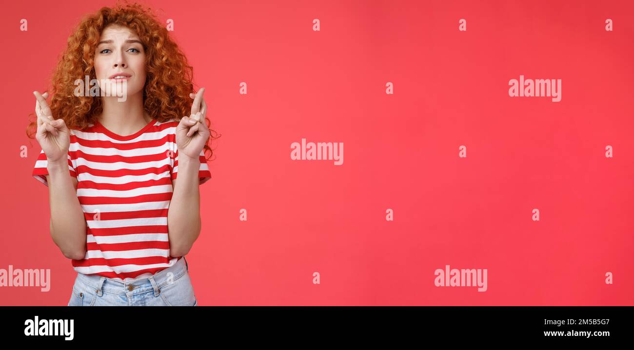 Nervous young silly timid cute redhead ginger girl anticipating hopeful ...