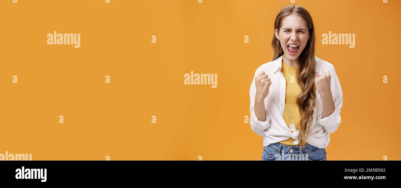 Girl feeling power overcome any trouble yelling to cheer up and boost ...