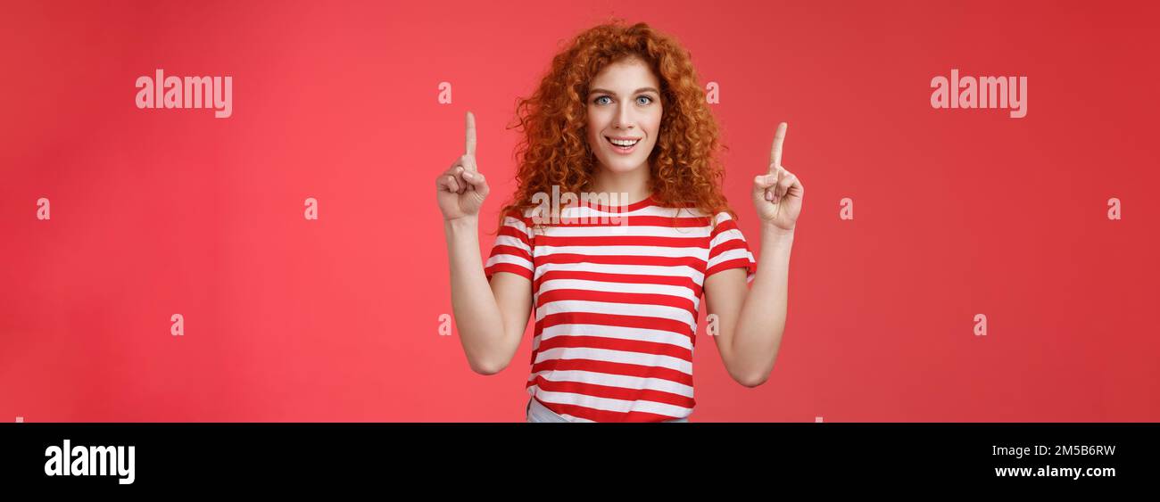 Excited good-looking cheeky redhead ginger girl curly natural hair ...