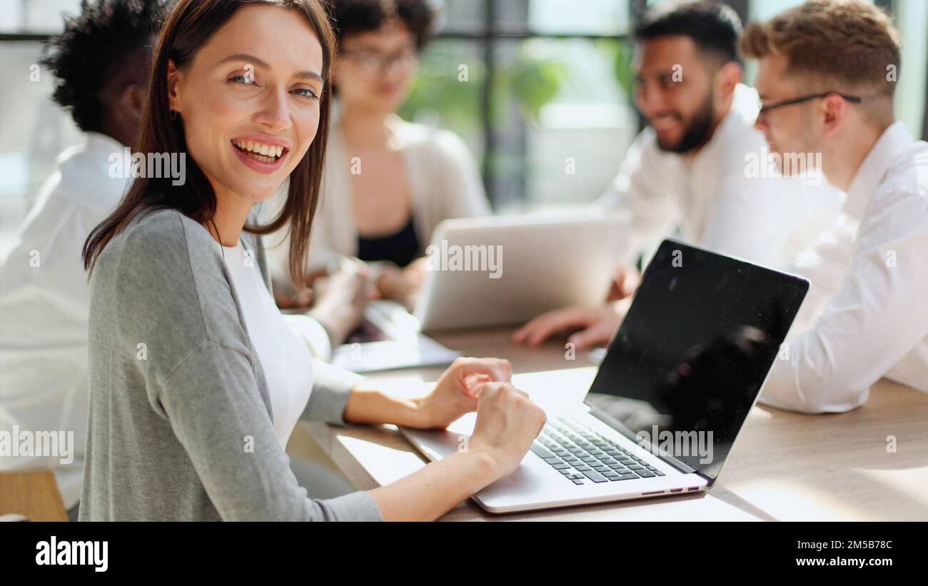 Smiling professional business leaders and employees group team portrait ...