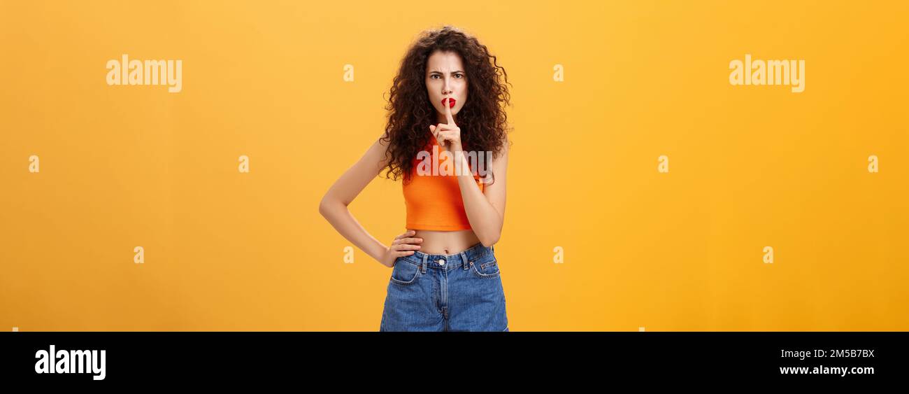 Sister displeased sibling saying cursing words standing serious and ...