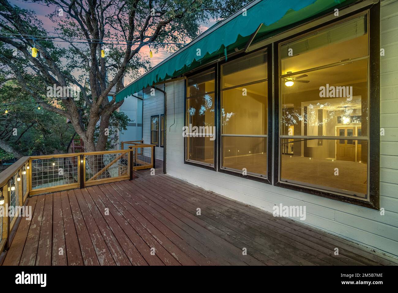 A home at sunset Stock Photo - Alamy