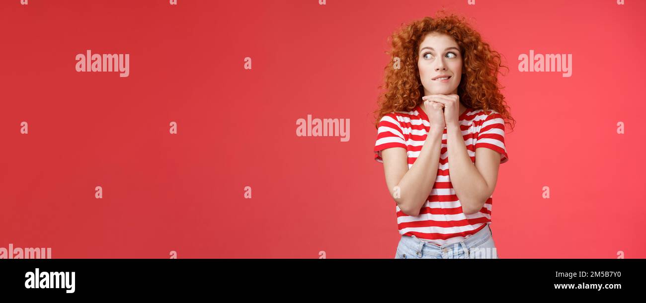 Cheerful intrigued redhead silly curly-haired woman smiling interested ...