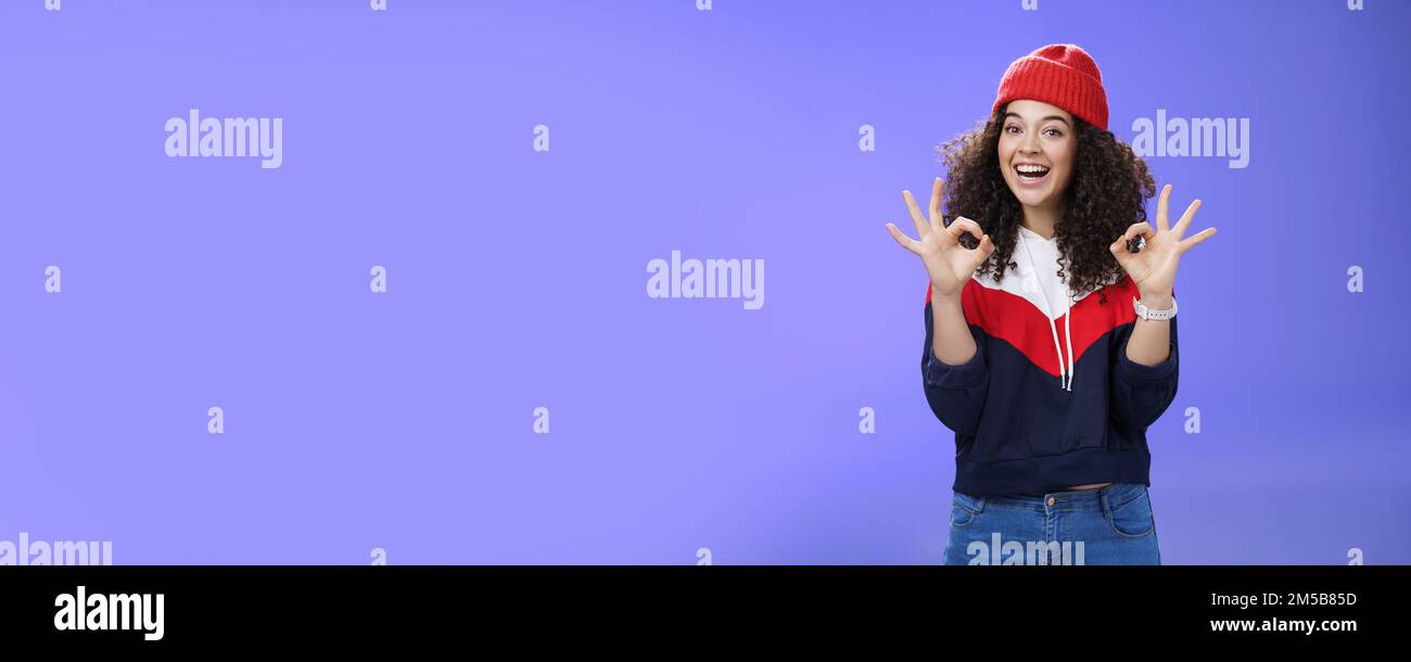 Got under control. Portrait of happy charming smiling curly-haired ...