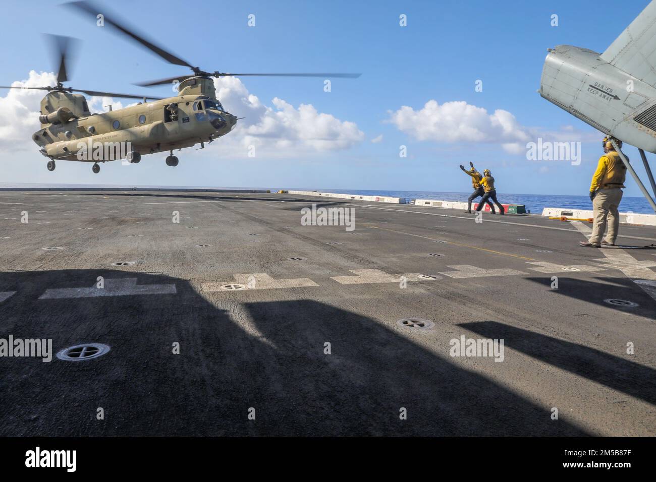 U.S. Navy aviation boatswain mate handlers with the USS Portland (LPD ...