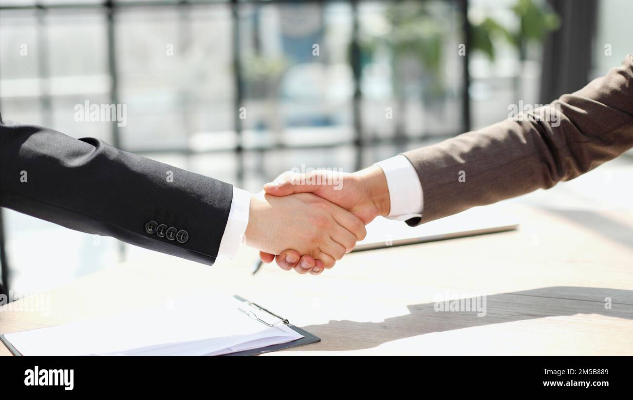 Business shaking hands, finishing up meeting. Successful businessmen ...