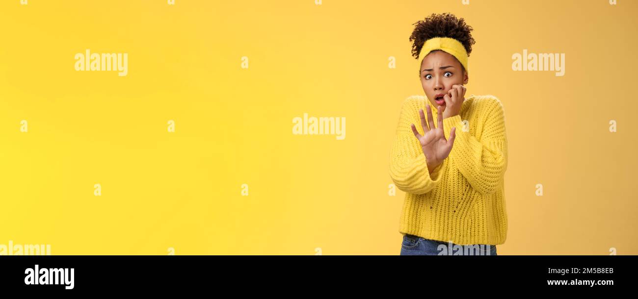 Terrified female victim scared abuse look afraid frightened extend arm ...