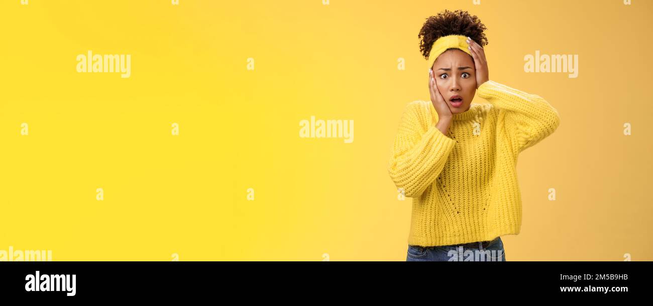 Shocked terrified timid insecure young stylish african-american woman ...