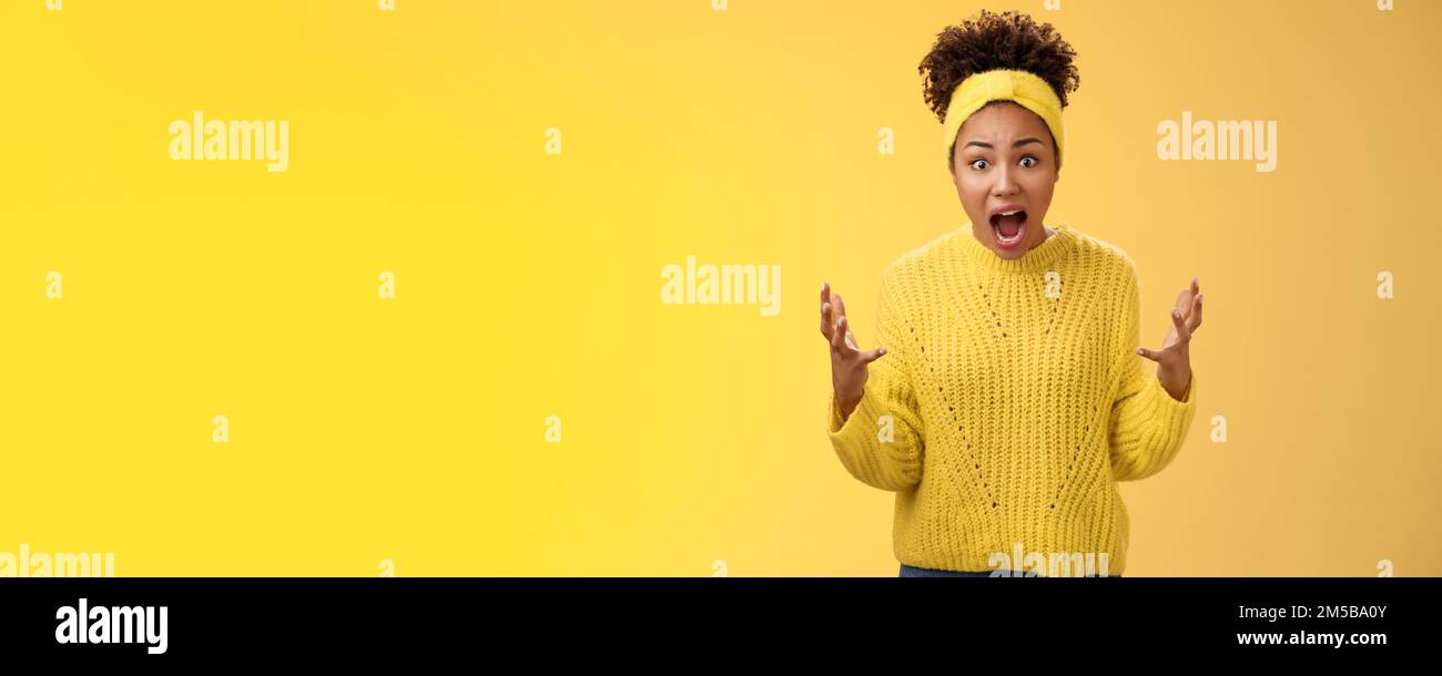 Shocked stunned african-american disappointed woman cannot believe ...