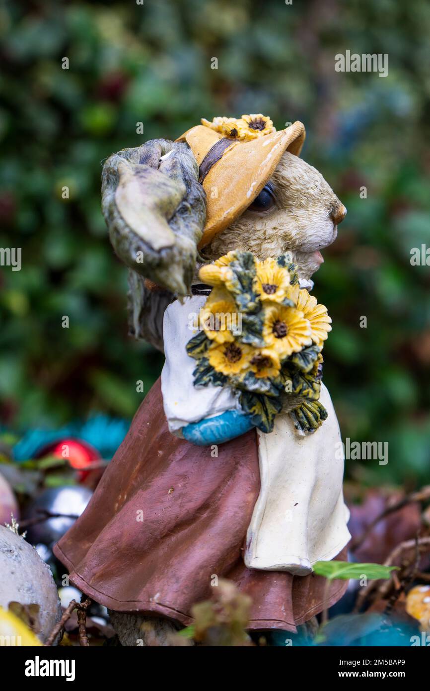 Female mouse with a vintage dress and sunflowers Stock Photo - Alamy