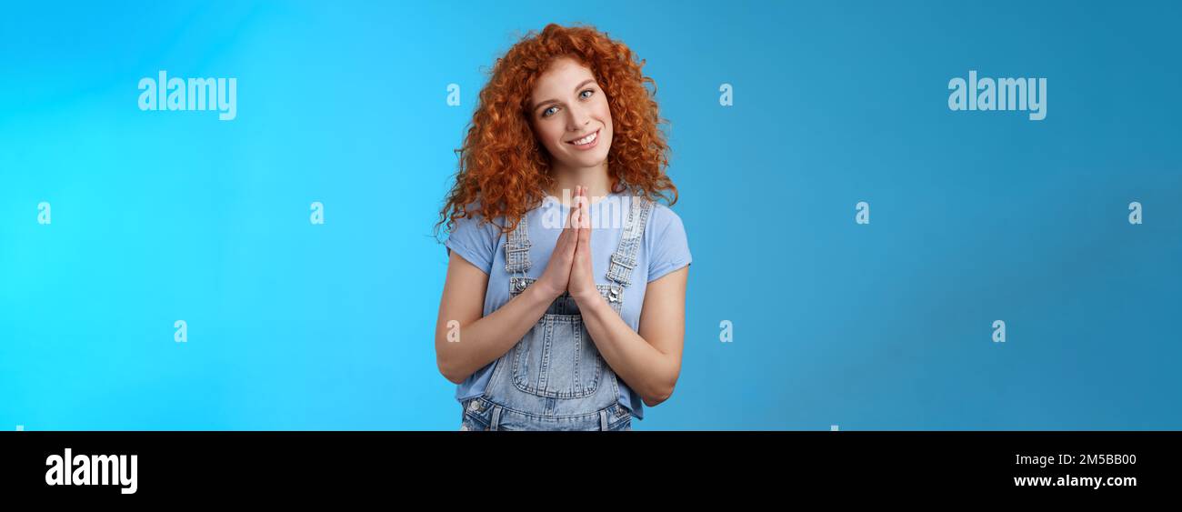Girl acting like nun redhead cute curly female press palms together ...