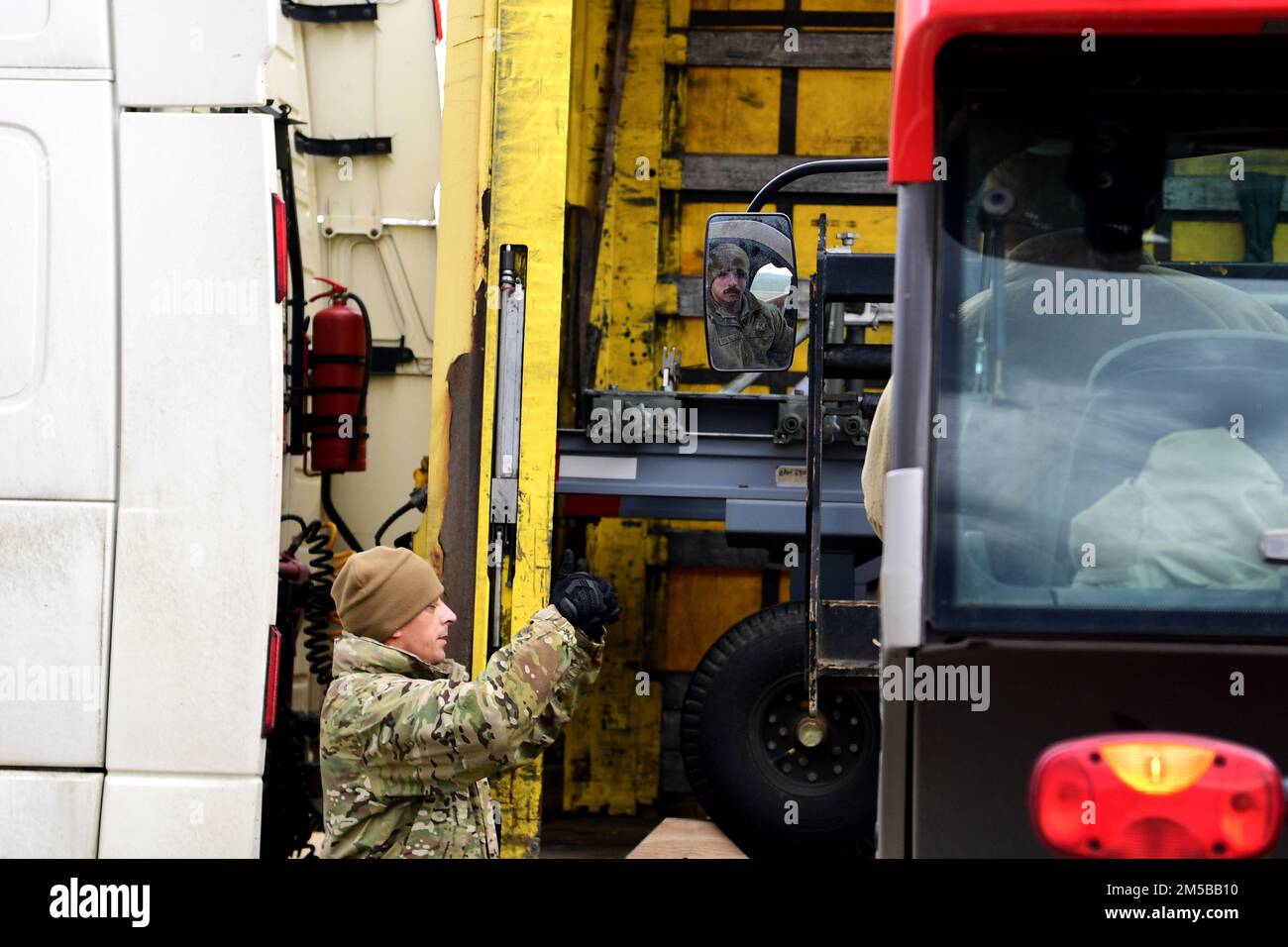 Members assigned to the 31st Fighter Wing unload cargo in Romania, Feb ...