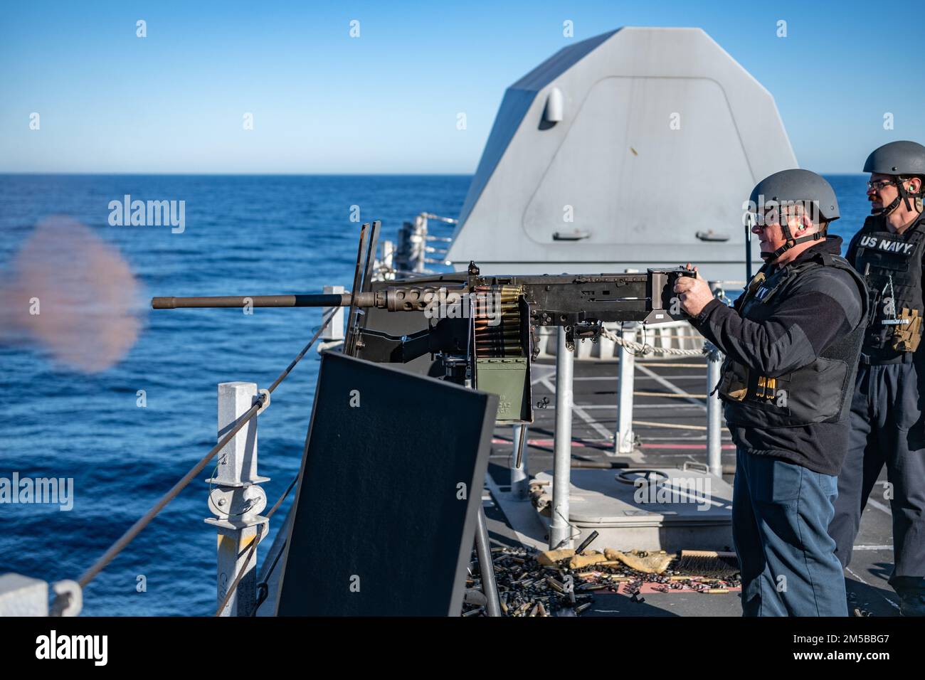 PACIFIC OCEAN (Feb. 18, 2022) – Chief Gunner’s Mate Nik Waugh fires a ...
