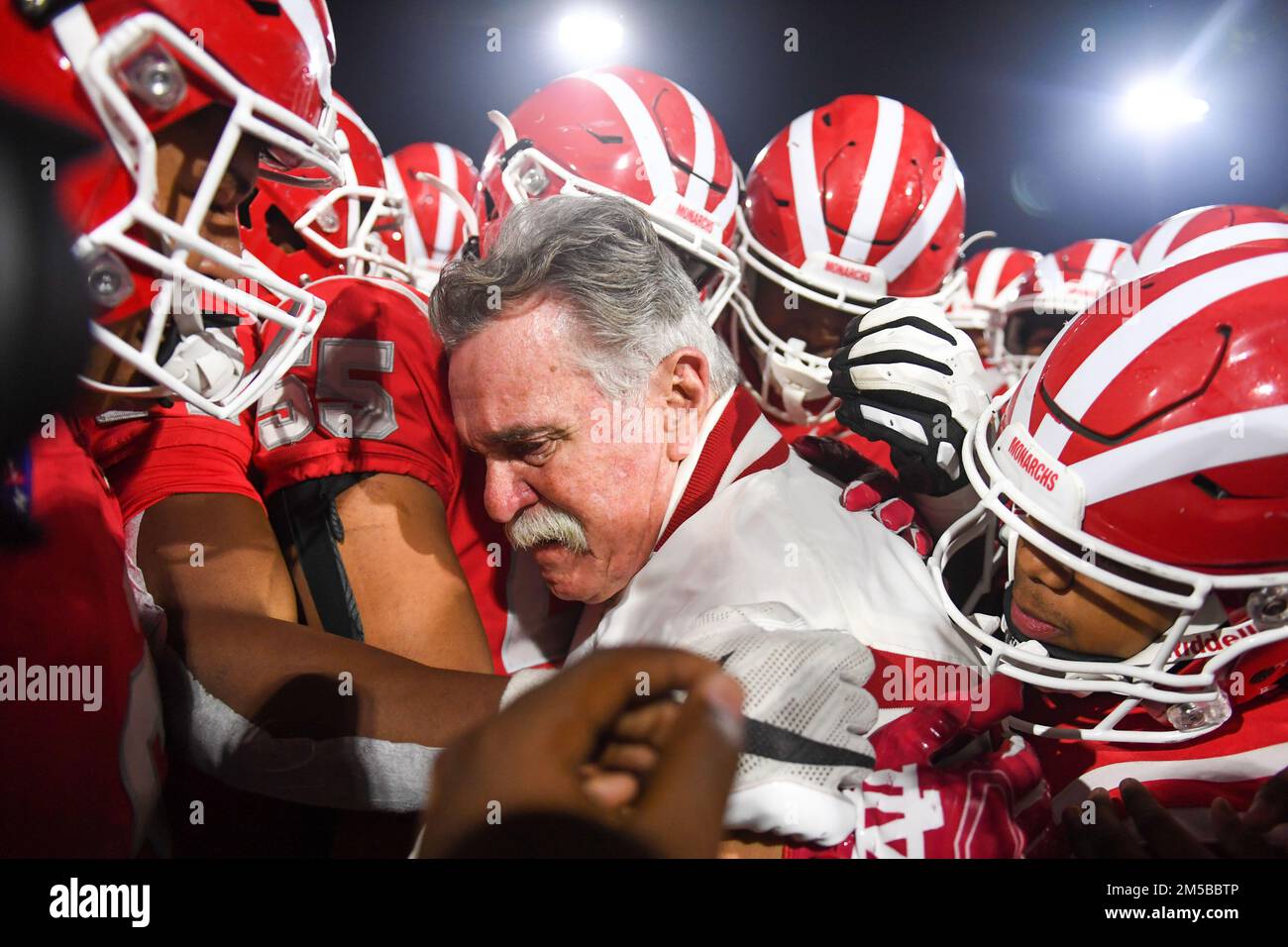 Mater Dei Monarchs head coach Bruce Rollinson is embraced by players ...