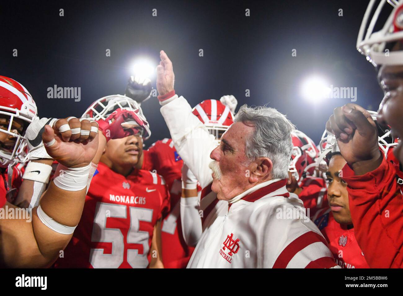 Mater Dei Monarchs head coach Bruce Rollinson is embraced by players ...