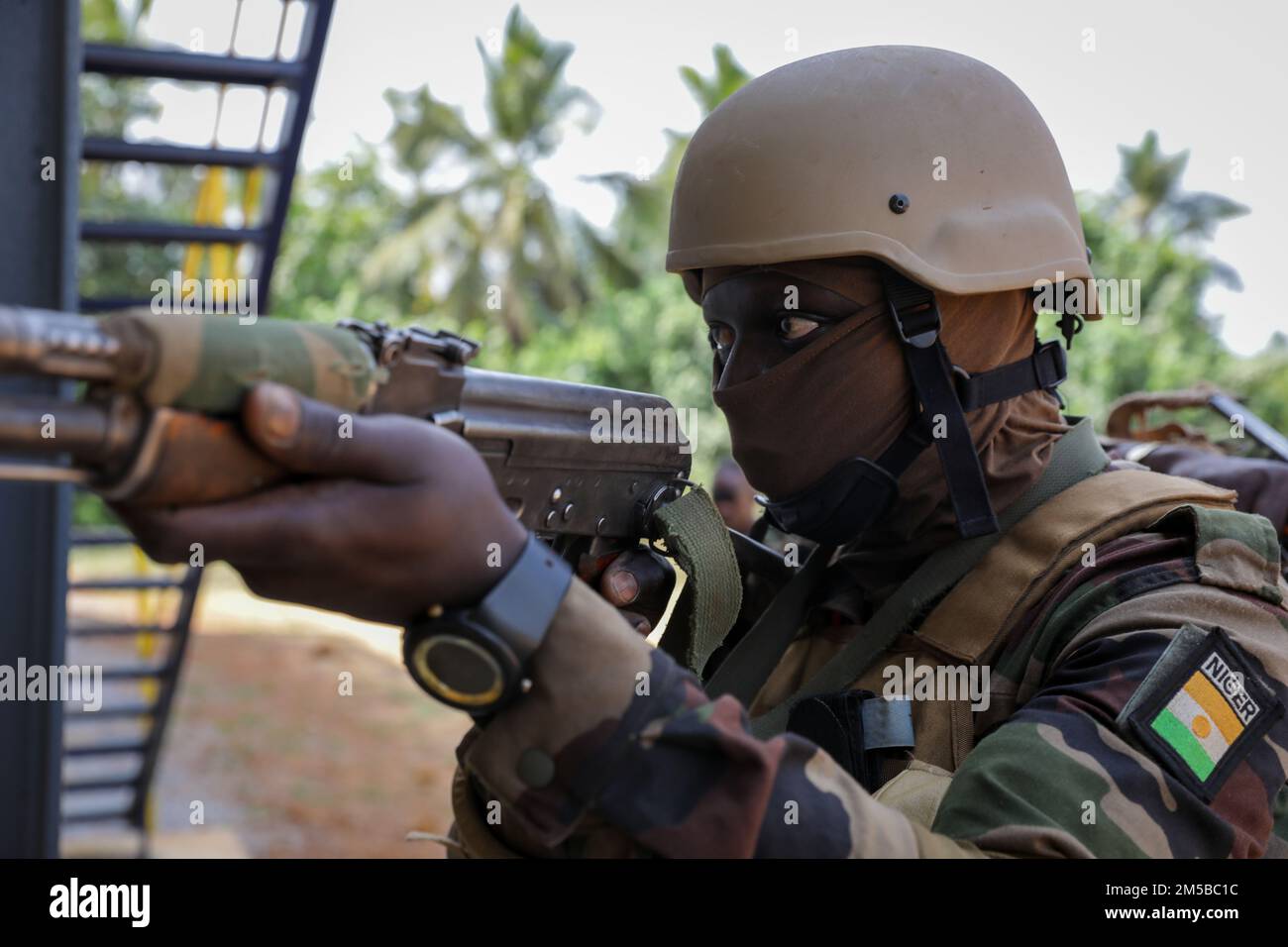 A Nigerian Armed Forces Soldier prepares to enter a building during ...