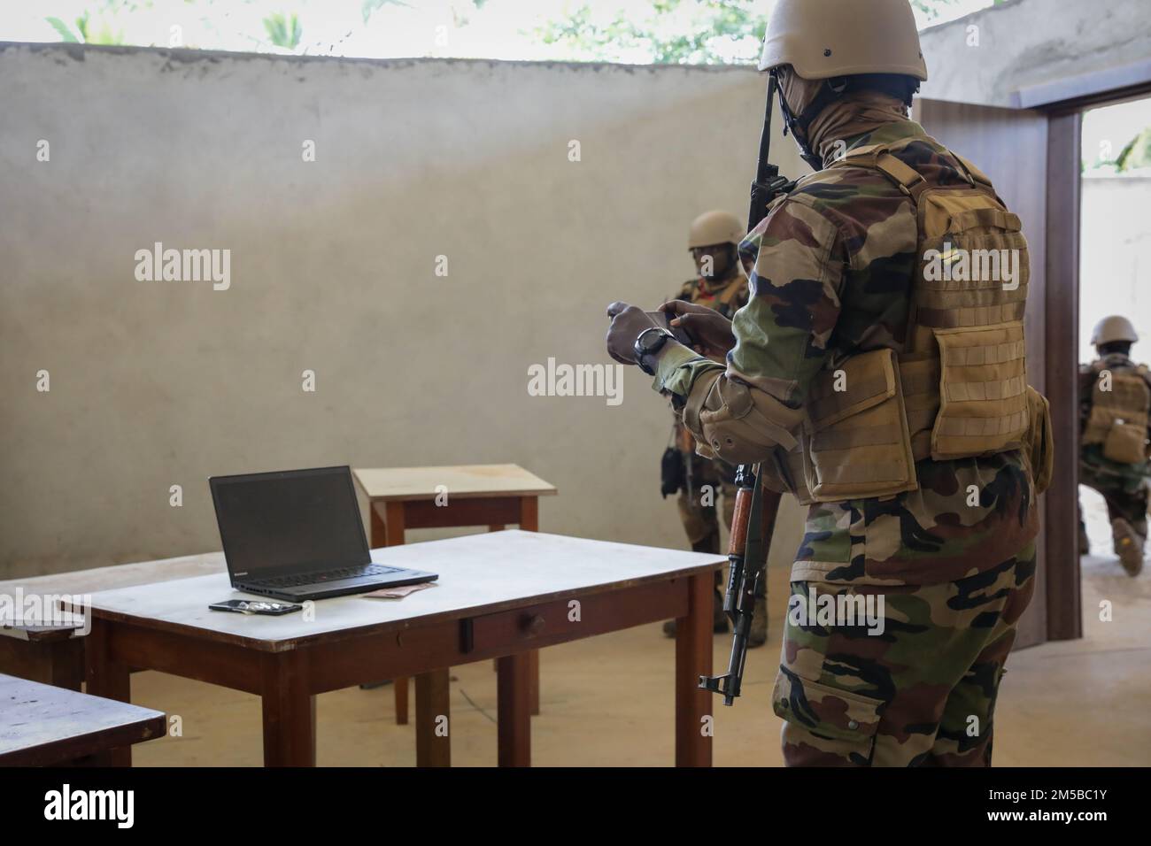 A Nigerian Armed Forces Soldier photographs sensitive items during ...