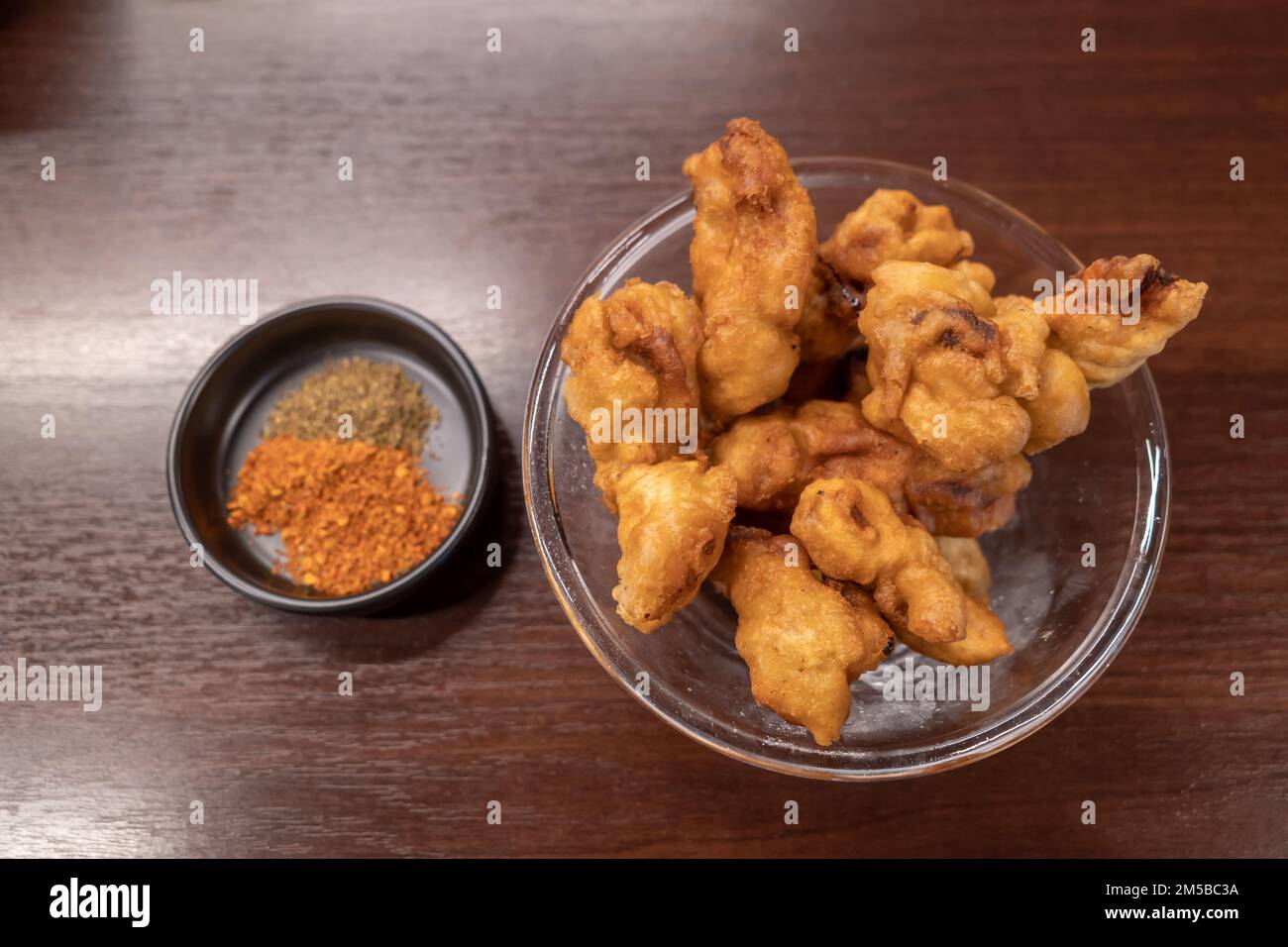 Chinese style of crispy fried belly pork with spicy chilli powder on ...