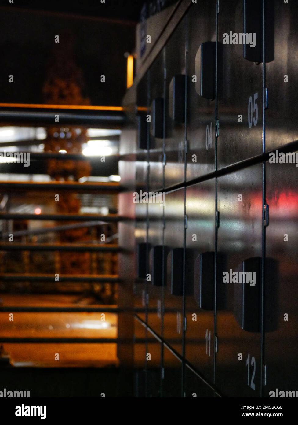 A vertical closeup shot of black lockers with numbers on them Stock ...