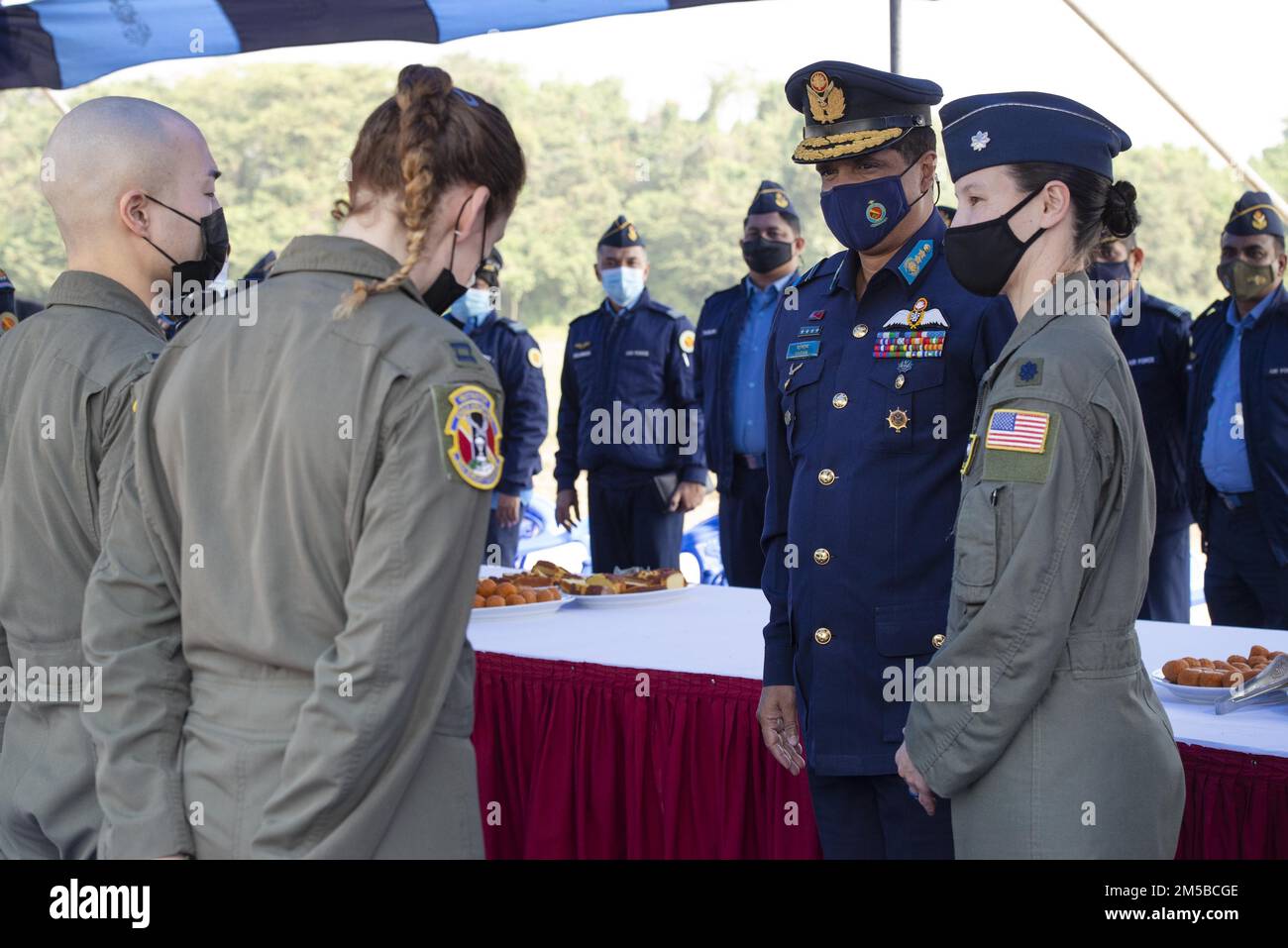 U.S. Air Force Lt. Col. Kira Coffey, right, 36th Expeditionary Airlift ...