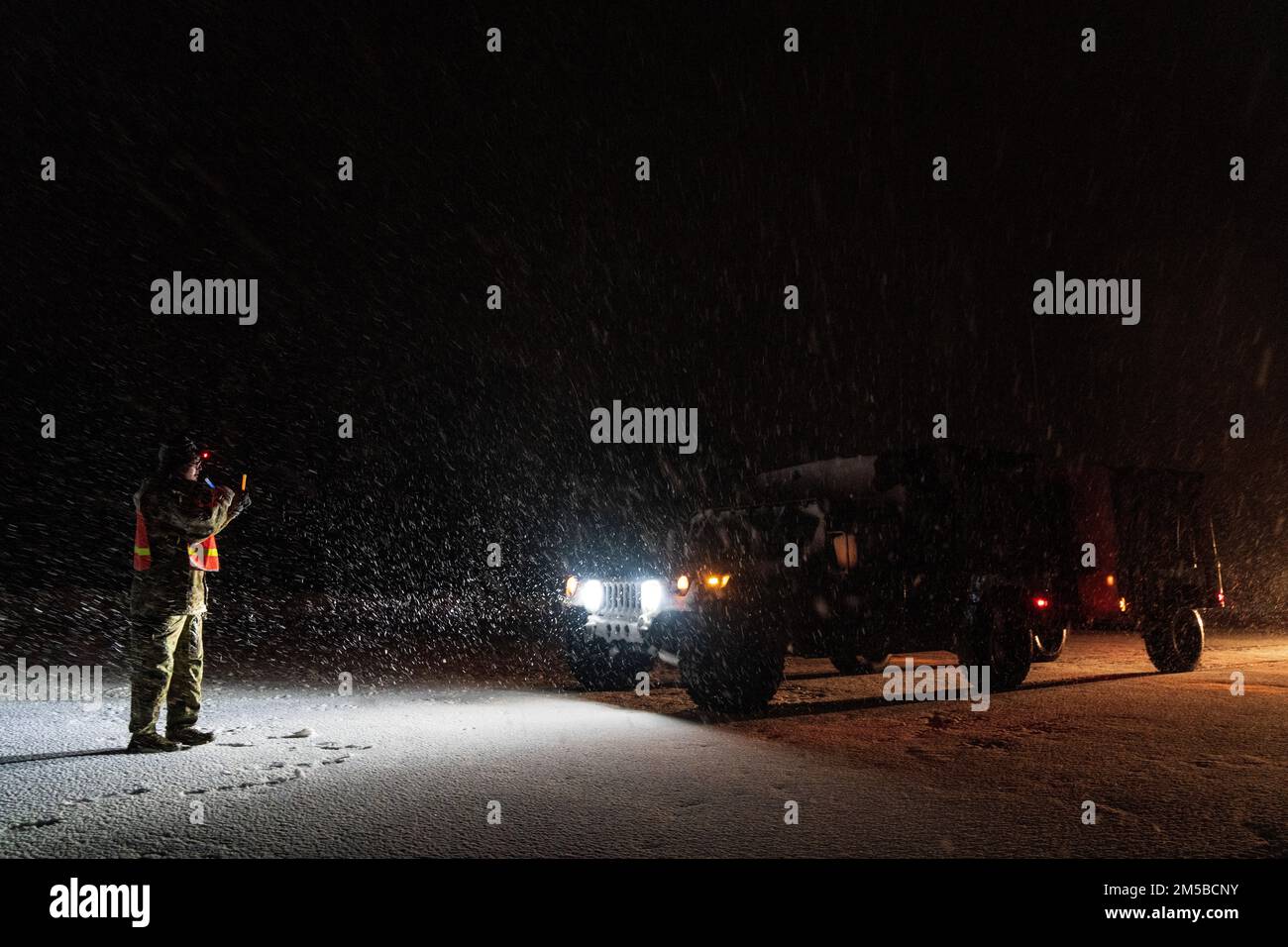 A U.S Army Soldier from the 12th Combat Aviation Brigade directs the ...
