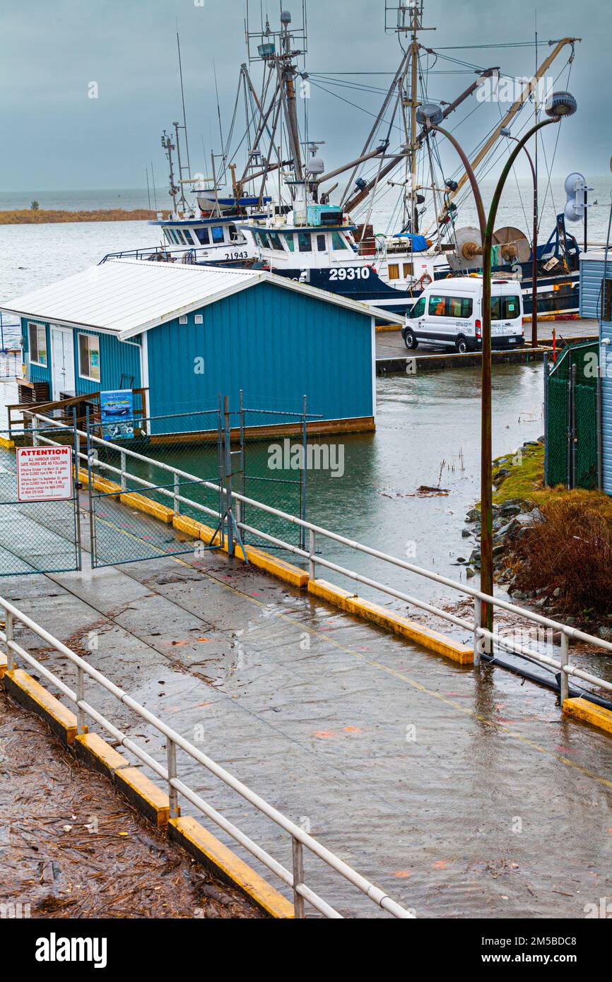 Partial submerged jetty during coastal flooding in Steveston British ...