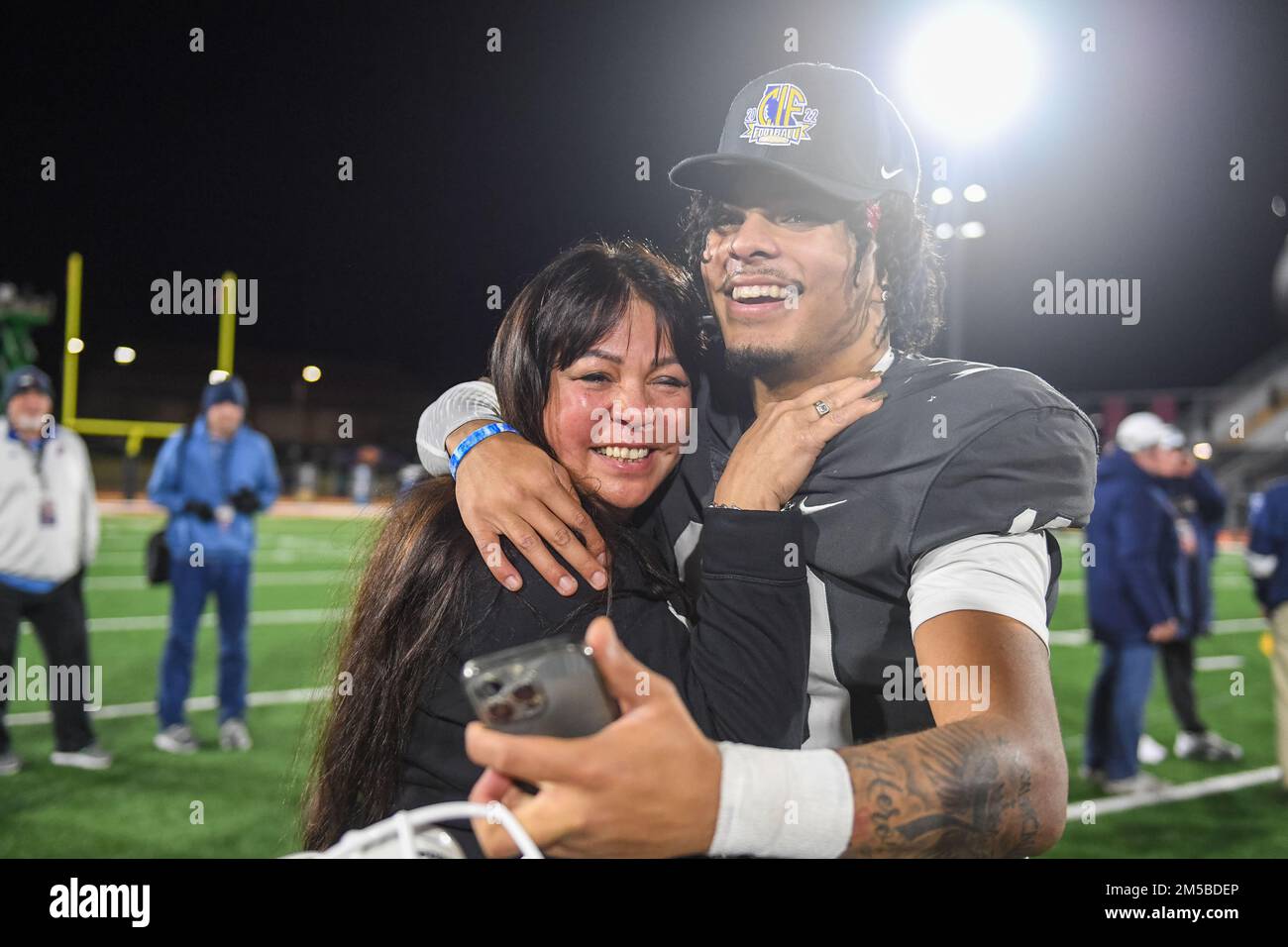 St. John Bosco Braves quarterback Pierce Clarkson (10) embraces his ...